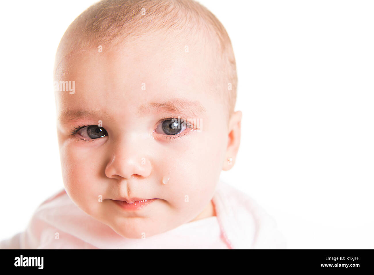 A Portrait of crying young baby on white background Stock Photo - Alamy