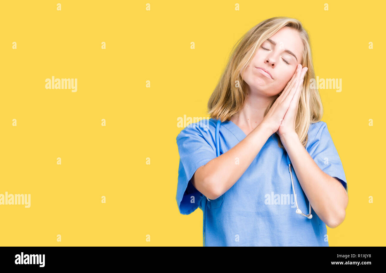 Beautiful young doctor woman wearing medical uniform over isolated ...