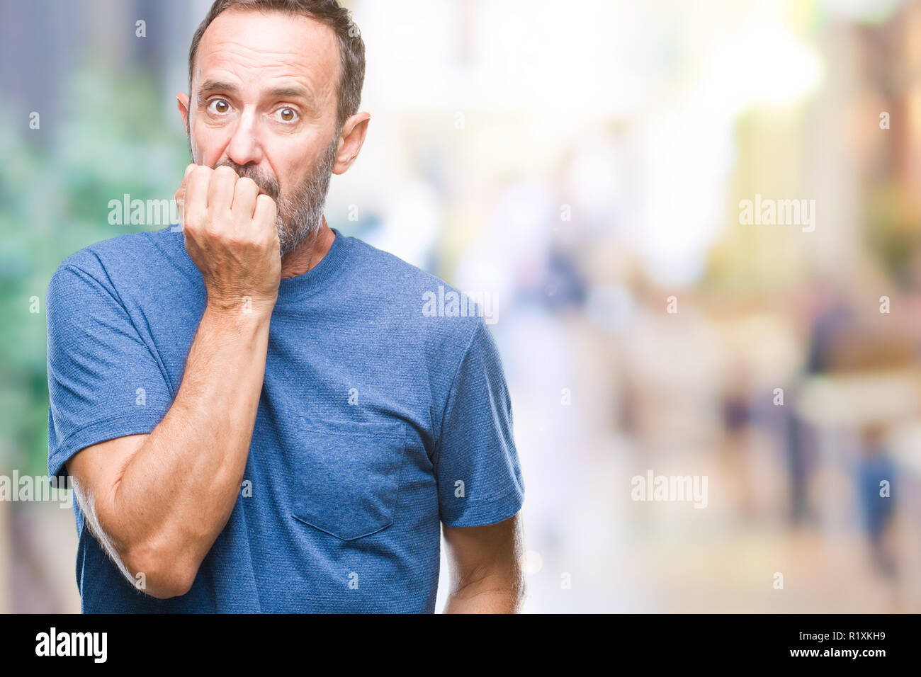 Middle age hoary senior man over isolated background looking stressed ...