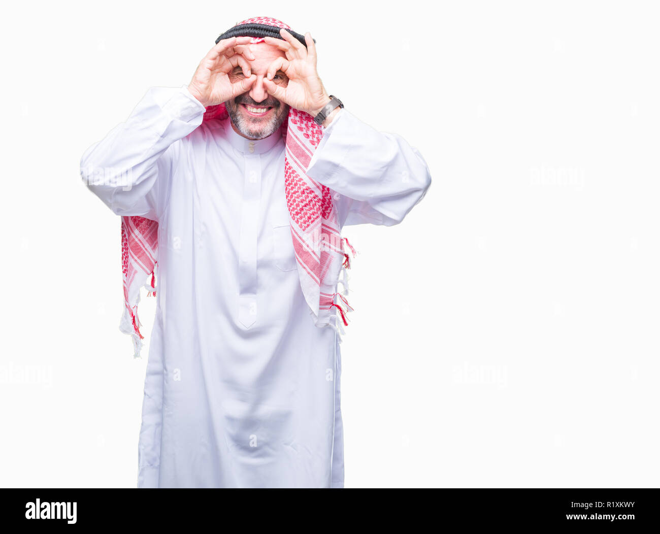 Senior arab man wearing keffiyeh over isolated background doing ok ...