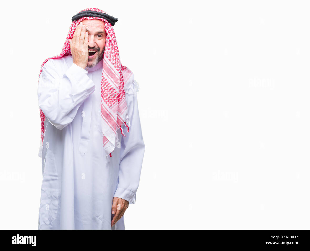 Senior arab man wearing keffiyeh over isolated background covering one ...
