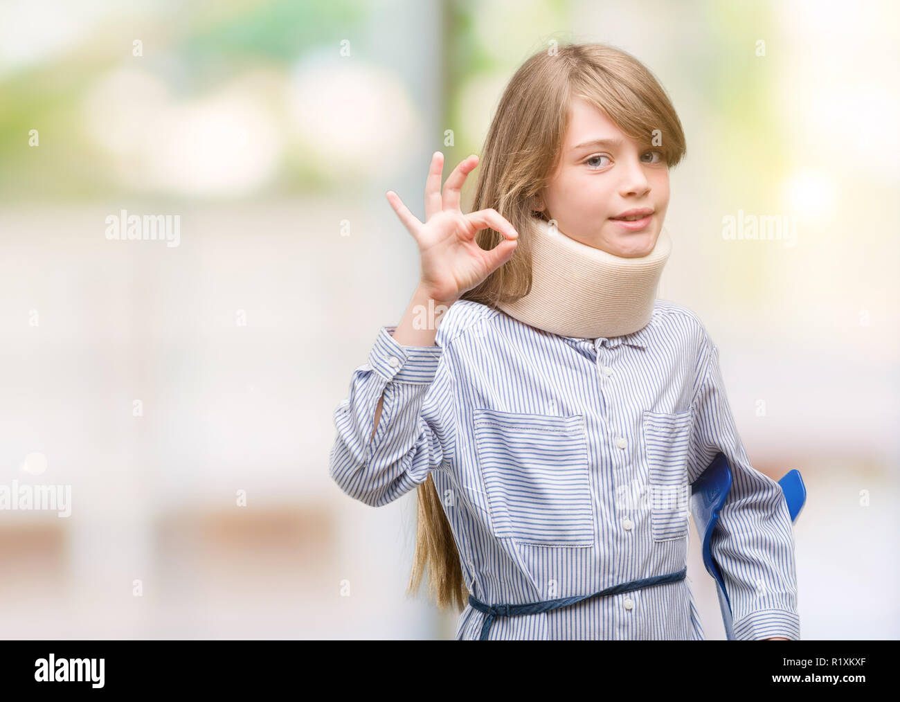 Young blonde child injured wearing neck collar and crutches doing ok ...