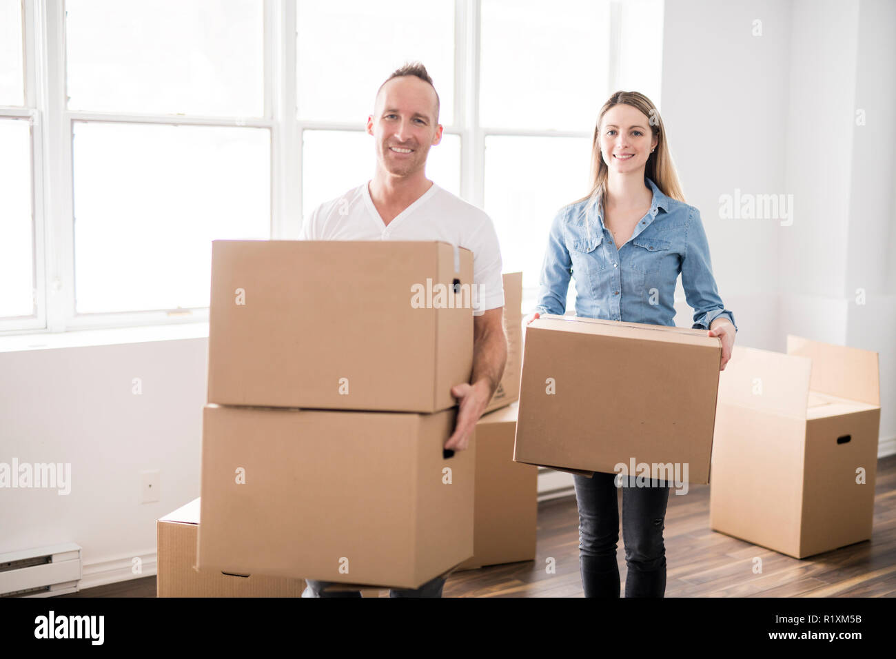 loving Couple moving from house at day time Stock Photo - Alamy