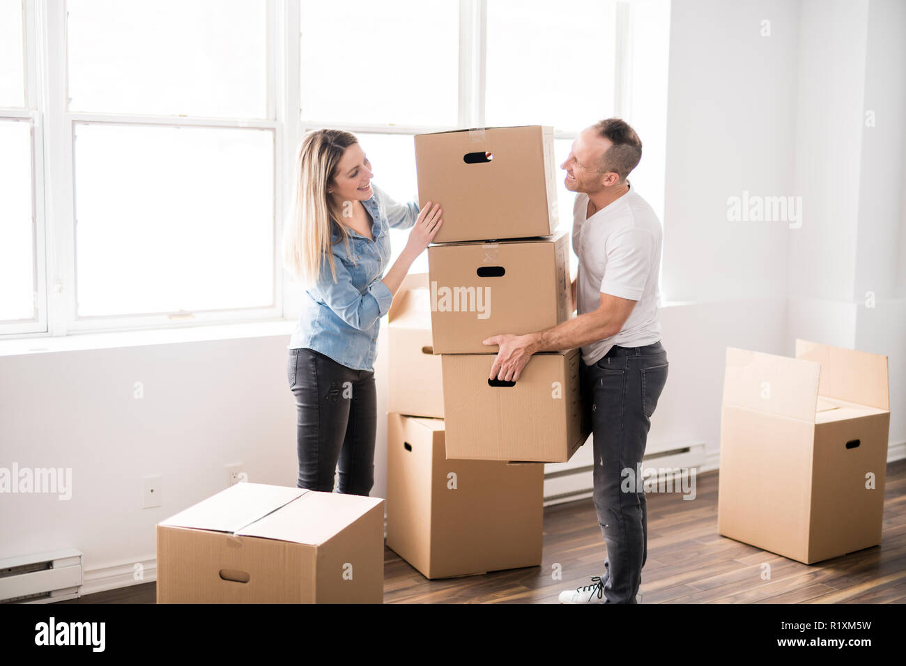 loving Couple moving from house at day time Stock Photo - Alamy