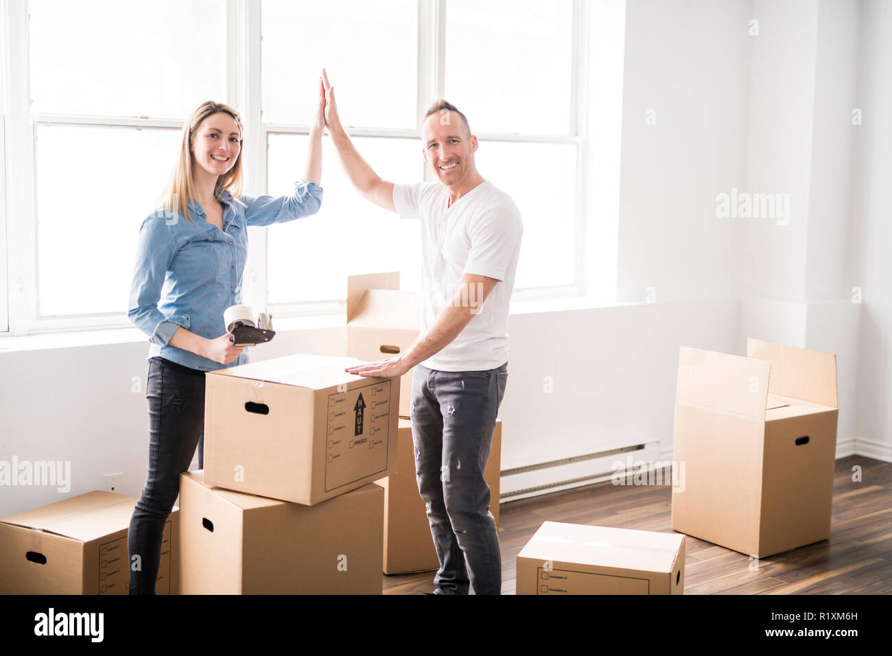 loving Couple moving from house at day time Stock Photo - Alamy