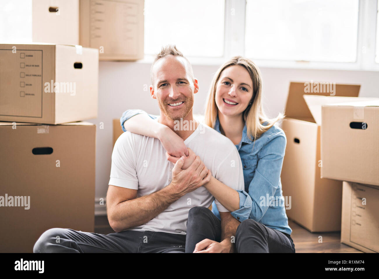 loving Couple moving from house at day time Stock Photo - Alamy