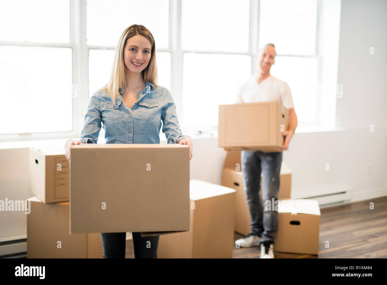 loving Couple moving from house at day time Stock Photo - Alamy