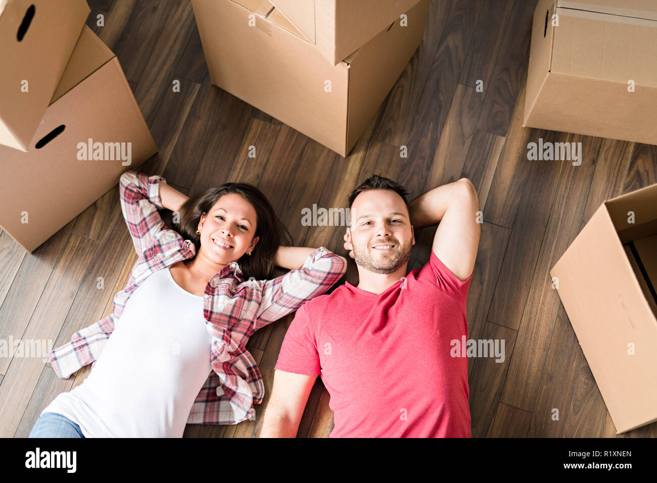 Loving Couple moving from house at day time Stock Photo - Alamy