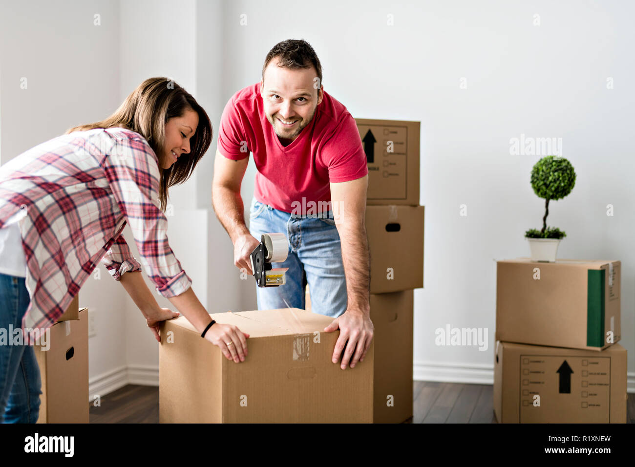 Loving Couple moving from house at day time Stock Photo - Alamy