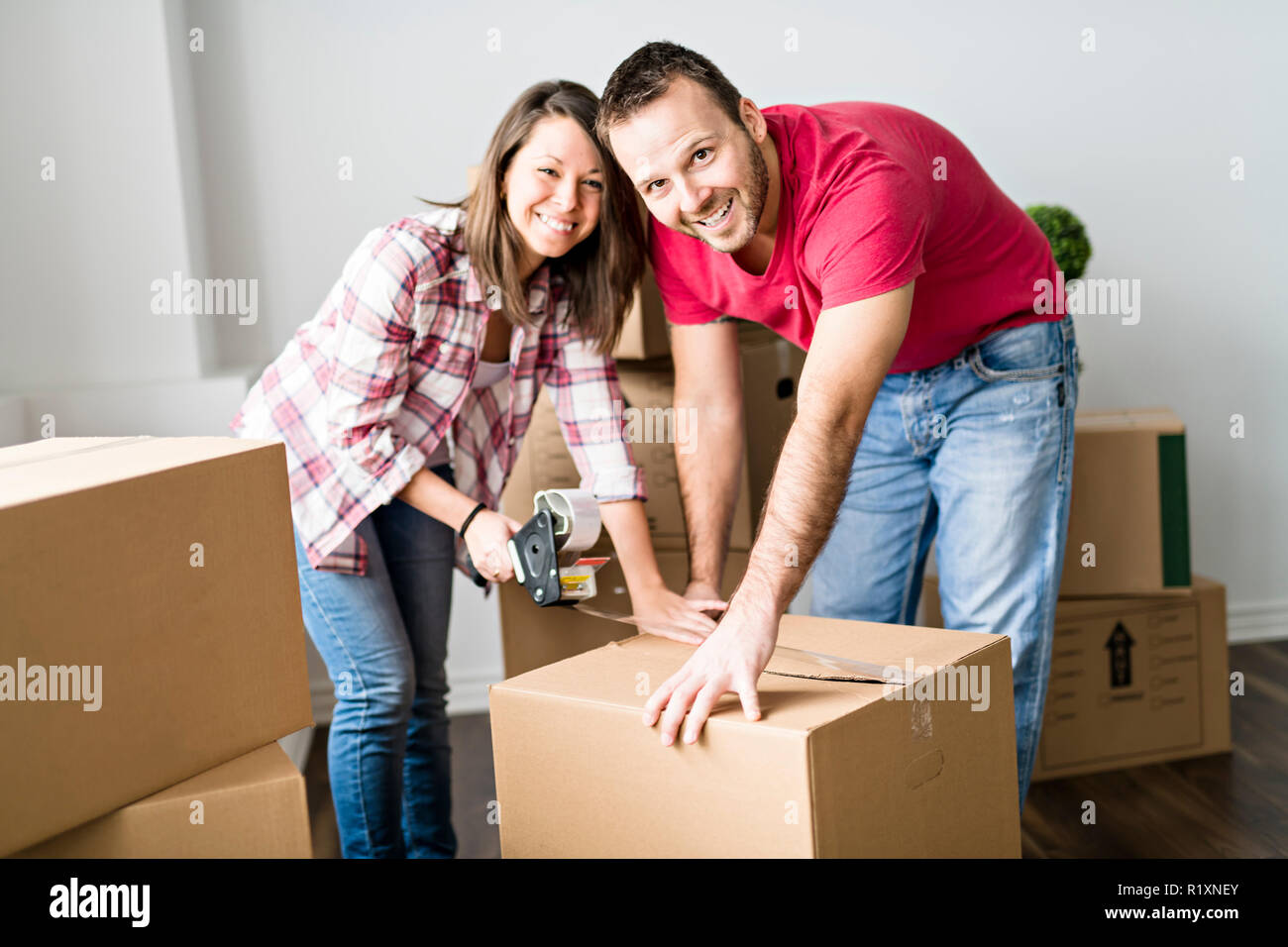 Loving Couple moving from house at day time Stock Photo - Alamy