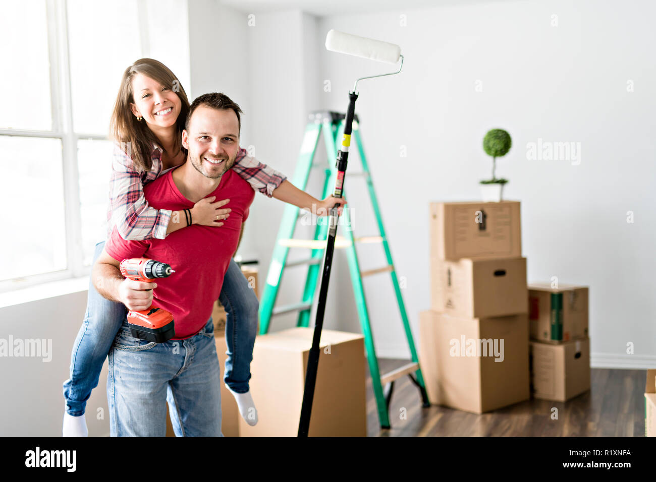 Loving Couple moving from house at day time Stock Photo - Alamy