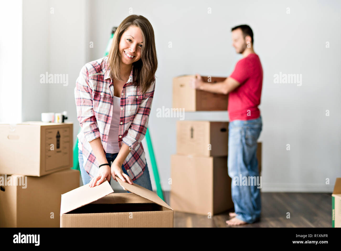 Loving Couple moving from house at day time Stock Photo - Alamy
