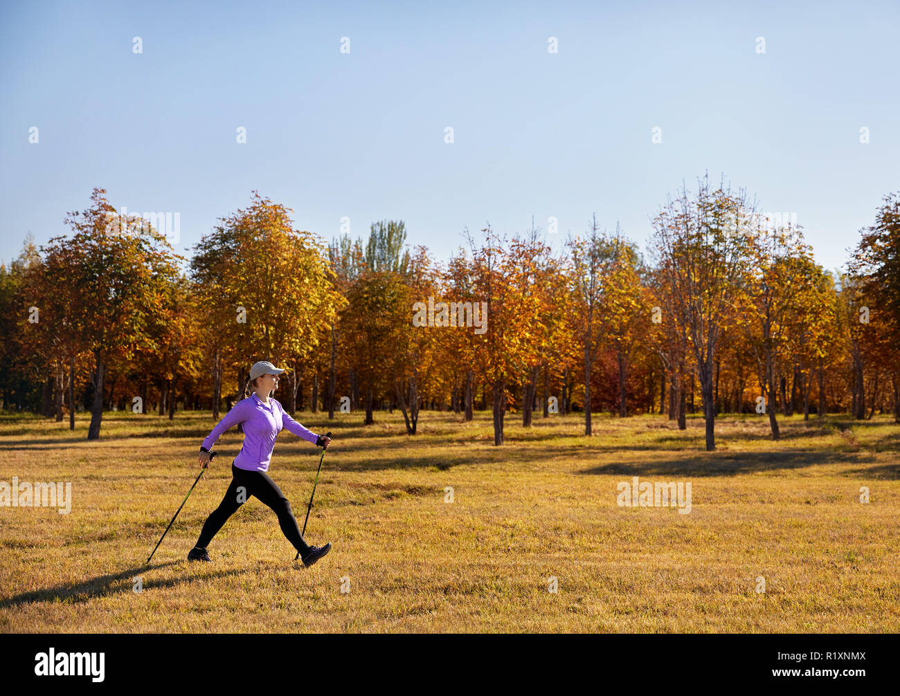 Woman walking outdoors park exercise hi-res stock photography and ...