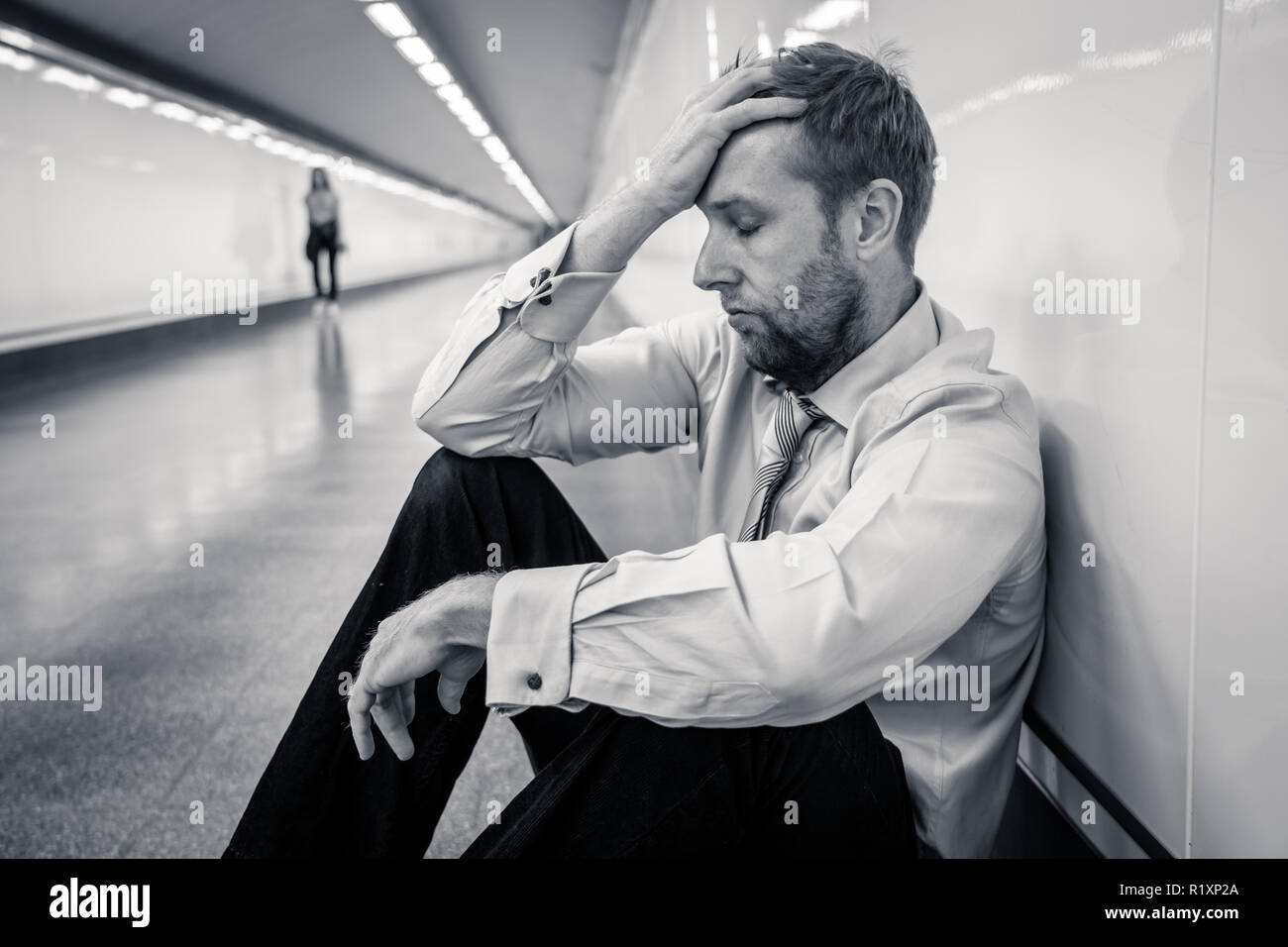 Desperate sad young businessman suffering emotional pain grief and deep ...