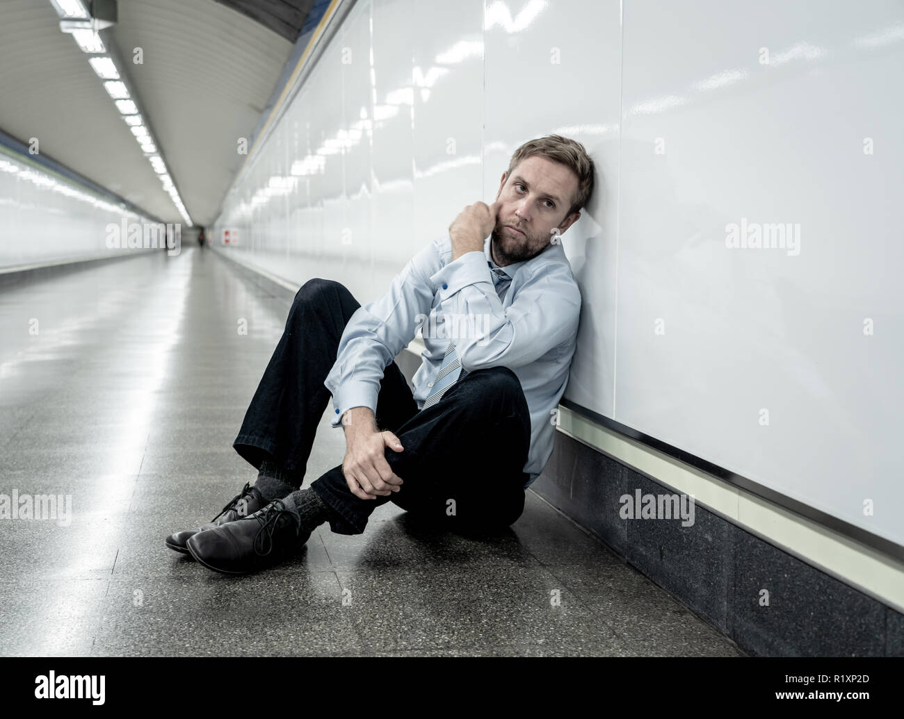 Desperate sad young businessman suffering emotional pain grief and deep ...