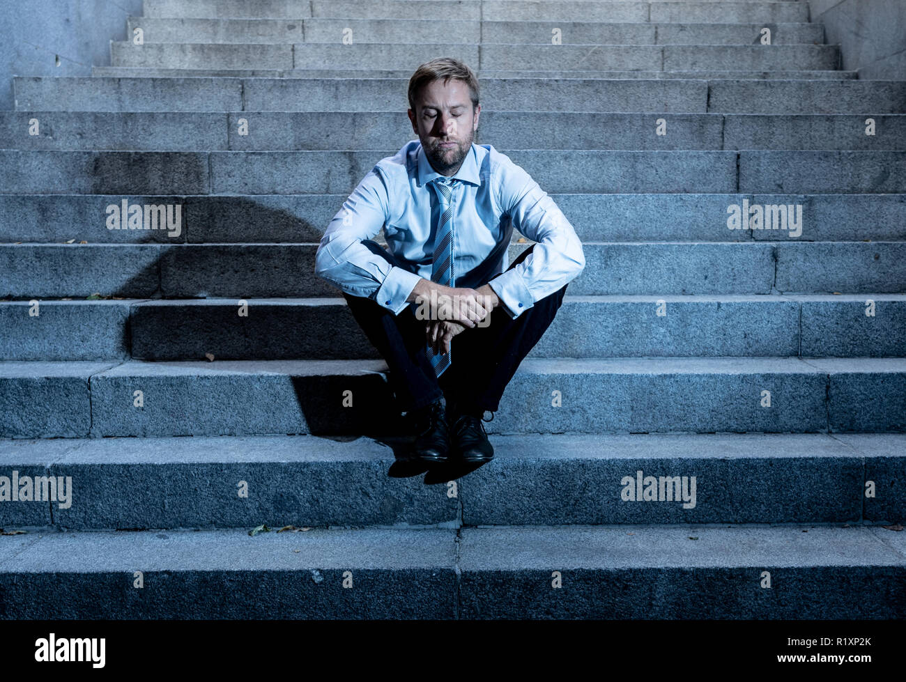 Young fired business man lost in depression crying abandoned sitting on ...
