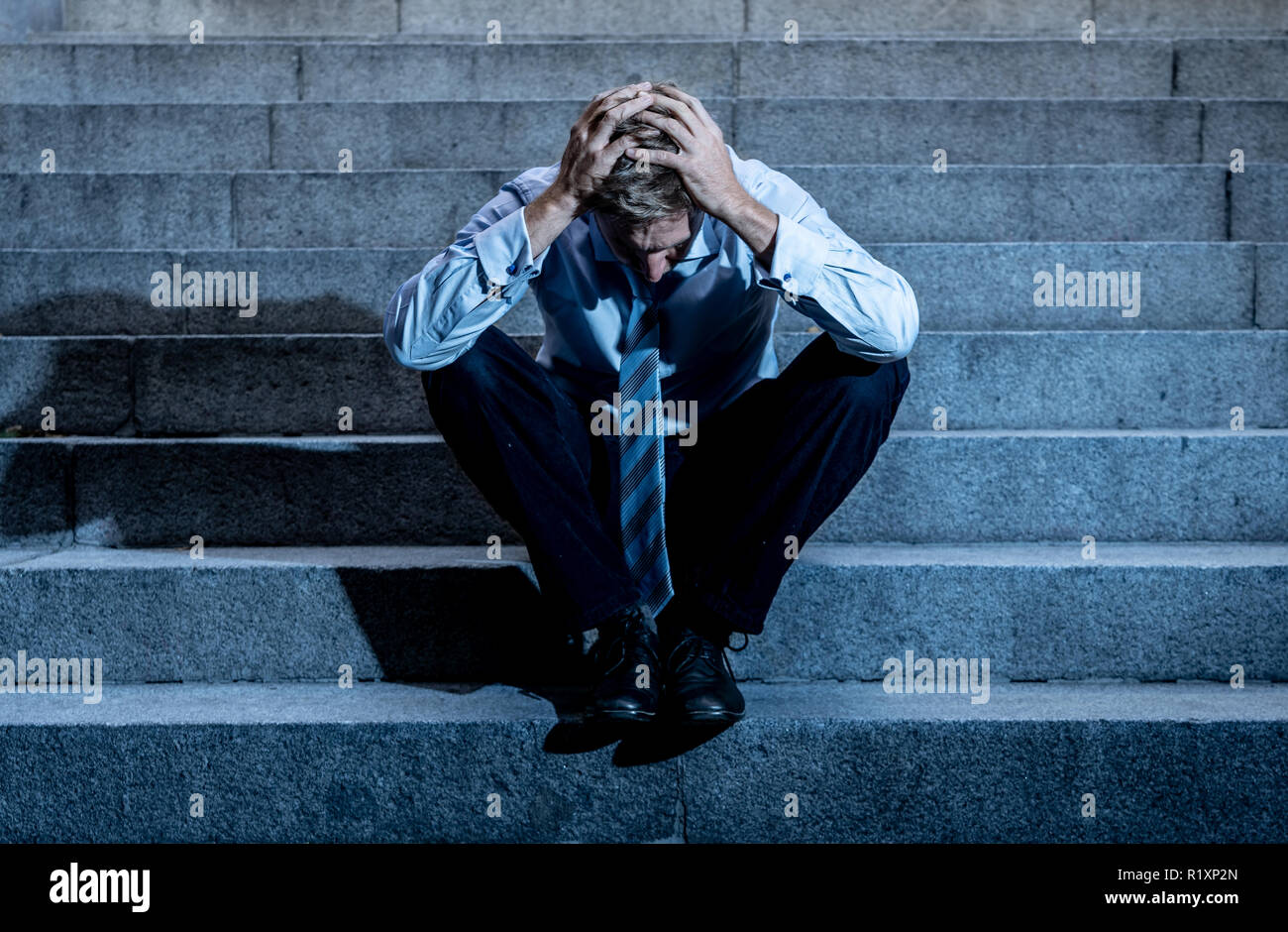 Young fired business man lost in depression crying abandoned sitting on ...
