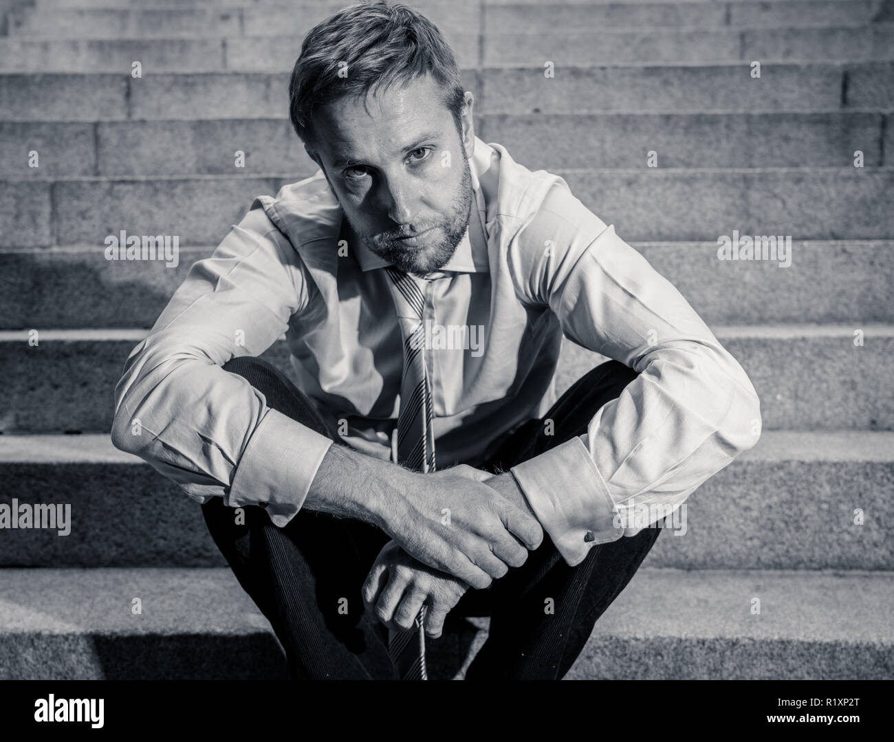 Young fired business man lost in depression crying abandoned sitting on ...