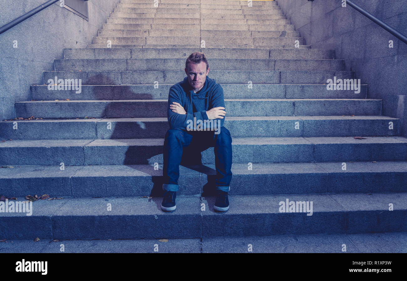 Young desperate jobless man in casual clothes abandoned lost in ...