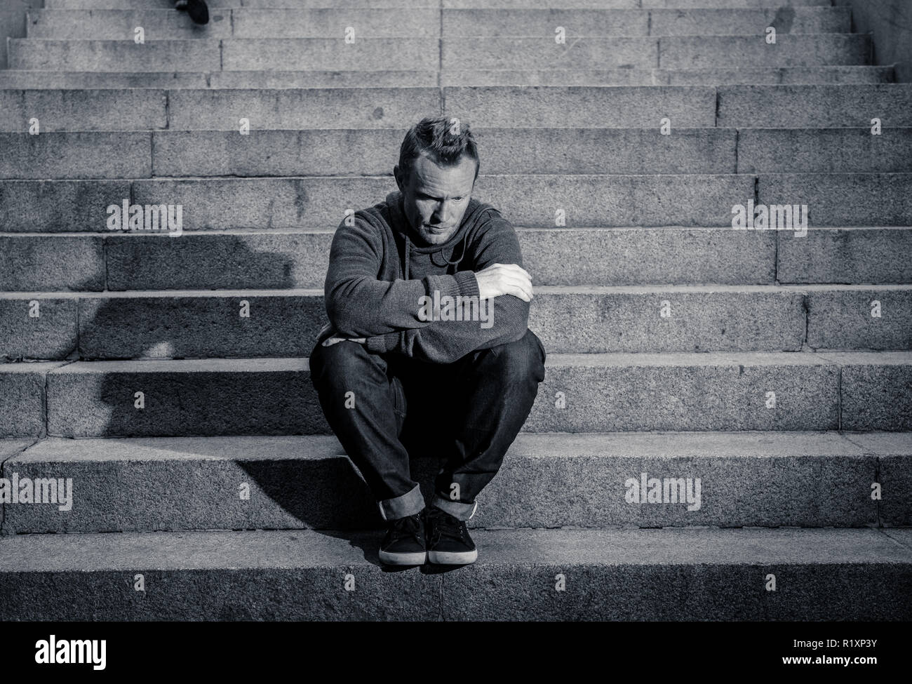 Young desperate jobless man in casual clothes abandoned lost in ...