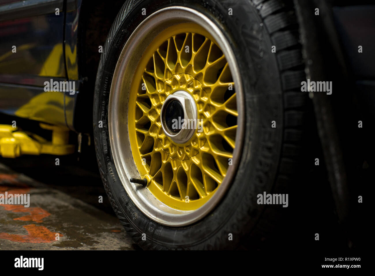 Legendary alloy net sport rims on beautiful wheels in polished and gold ...