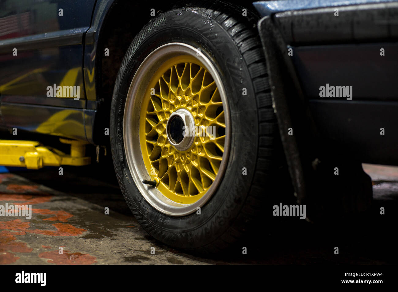 Legendary alloy net sport rims on beautiful wheels in polished and gold ...