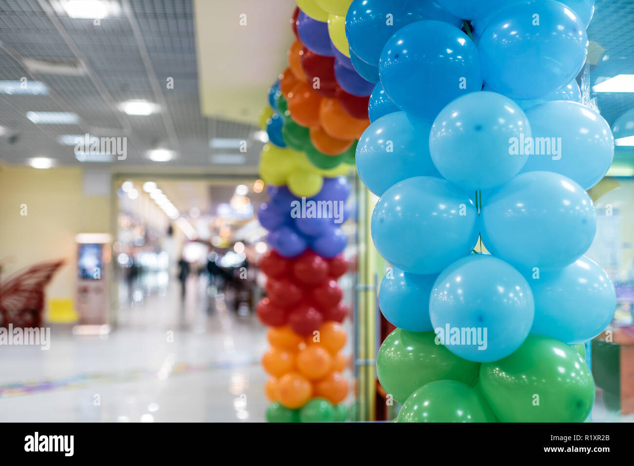 Colorful air balloons at openig new store in local mall Stock Photo - Alamy