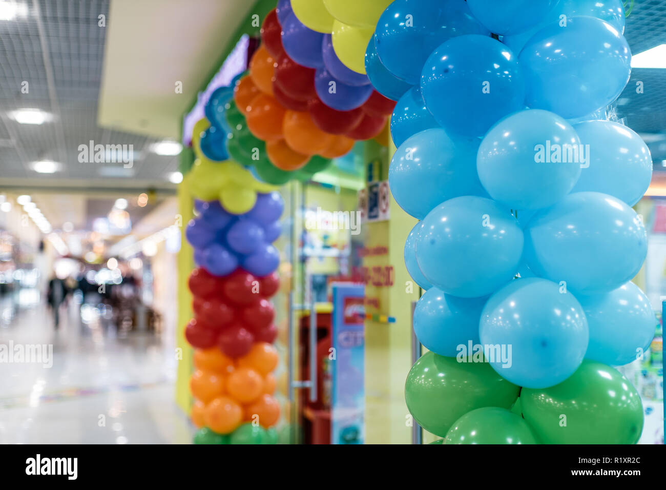 Colorful air balloons at openig new store in local mall Stock Photo - Alamy