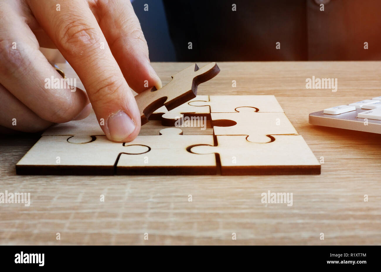 Business people connecting puzzle pieces hi-res stock photography and ...