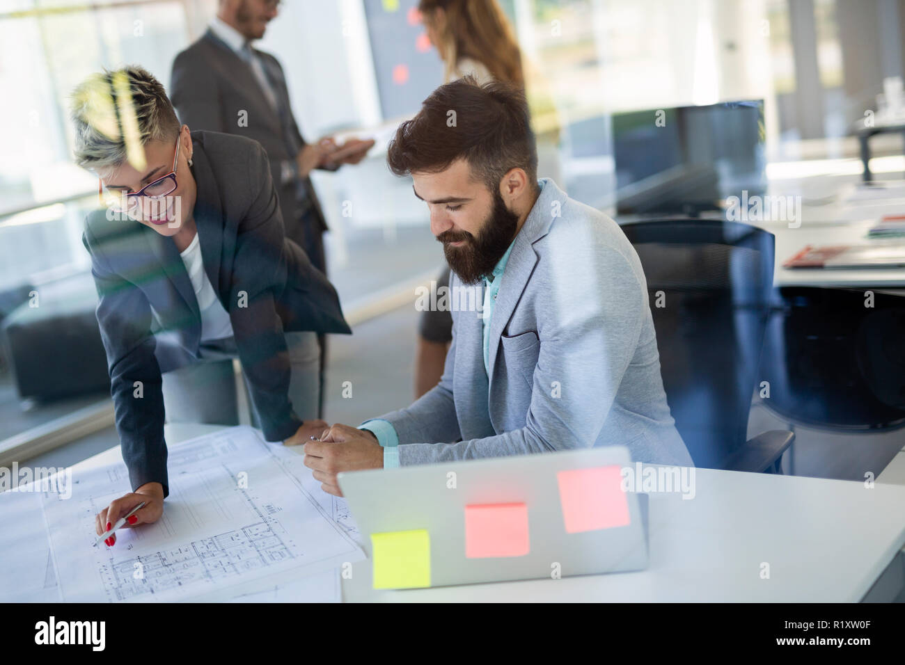 Group of business people collaborating in office Stock Photo - Alamy