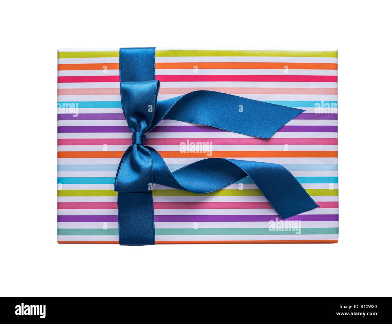 Gift in a bright striped wrapping paper Stock Photo - Alamy