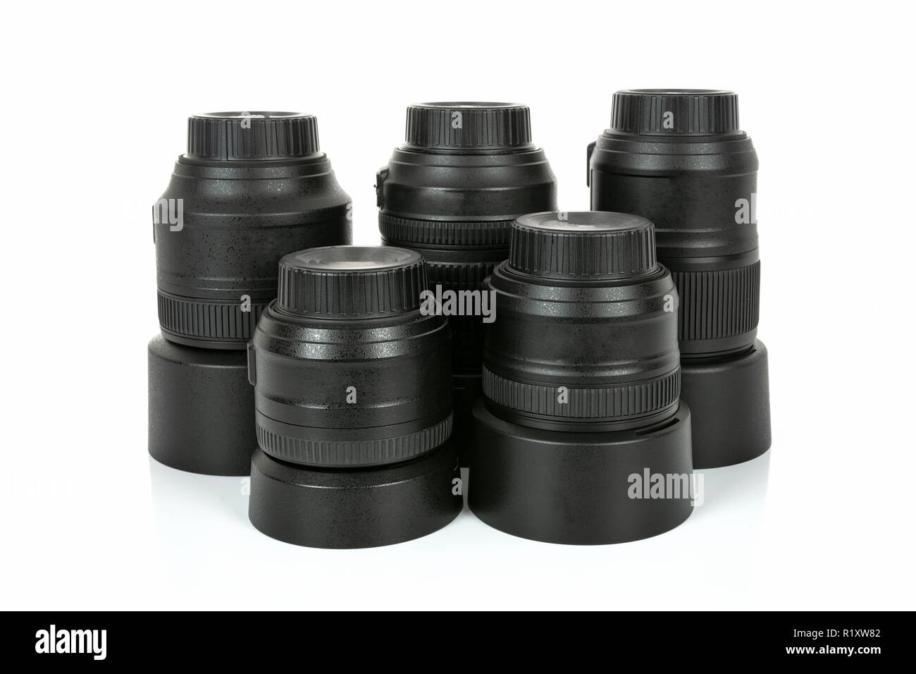 Group of professional and modern lenses for DSLR camera isolated on a ...