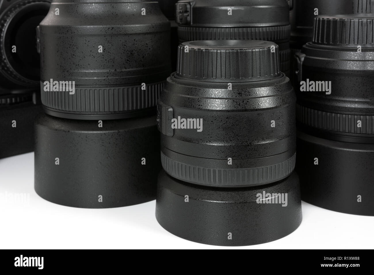 Collection of professional and modern lenses and DSLR camera in close ...