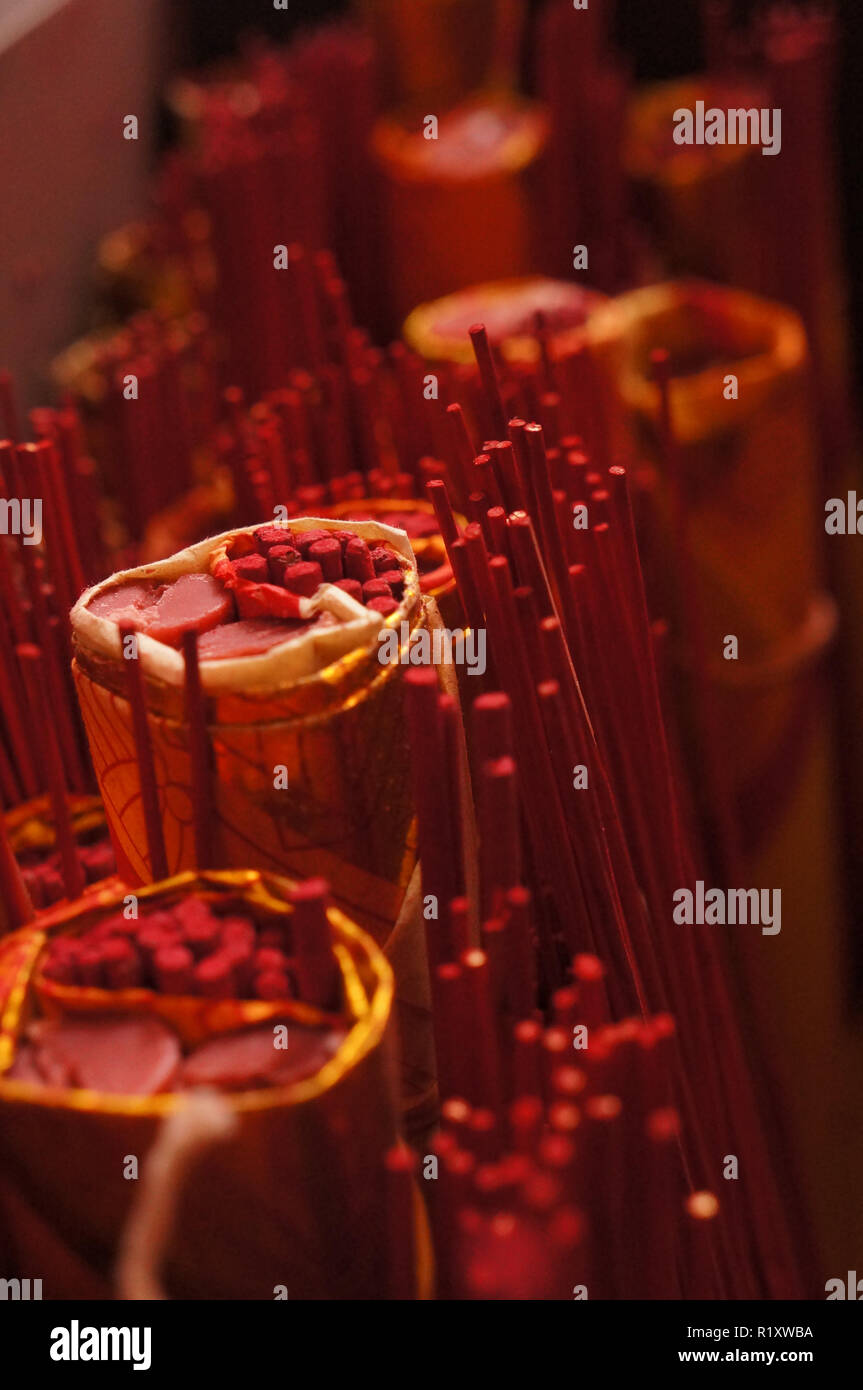 Monk burning an incense stick hi-res stock photography and images - Alamy