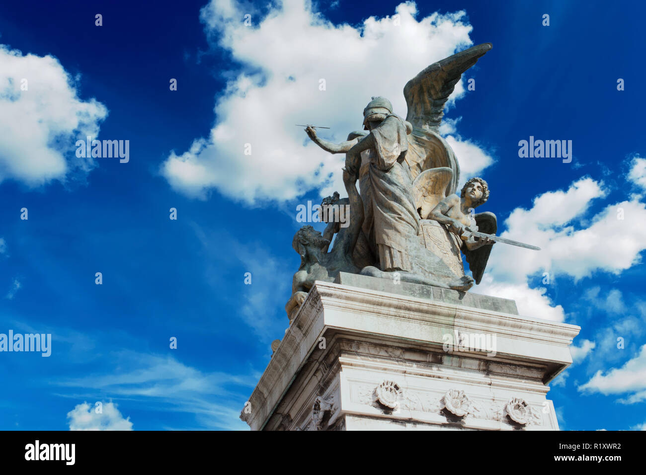 Bronze statues and blue sky over the marbles of the Altare della Patria ...