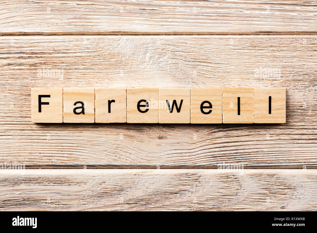 farewell word written on wood block. farewell text on table, concept ...