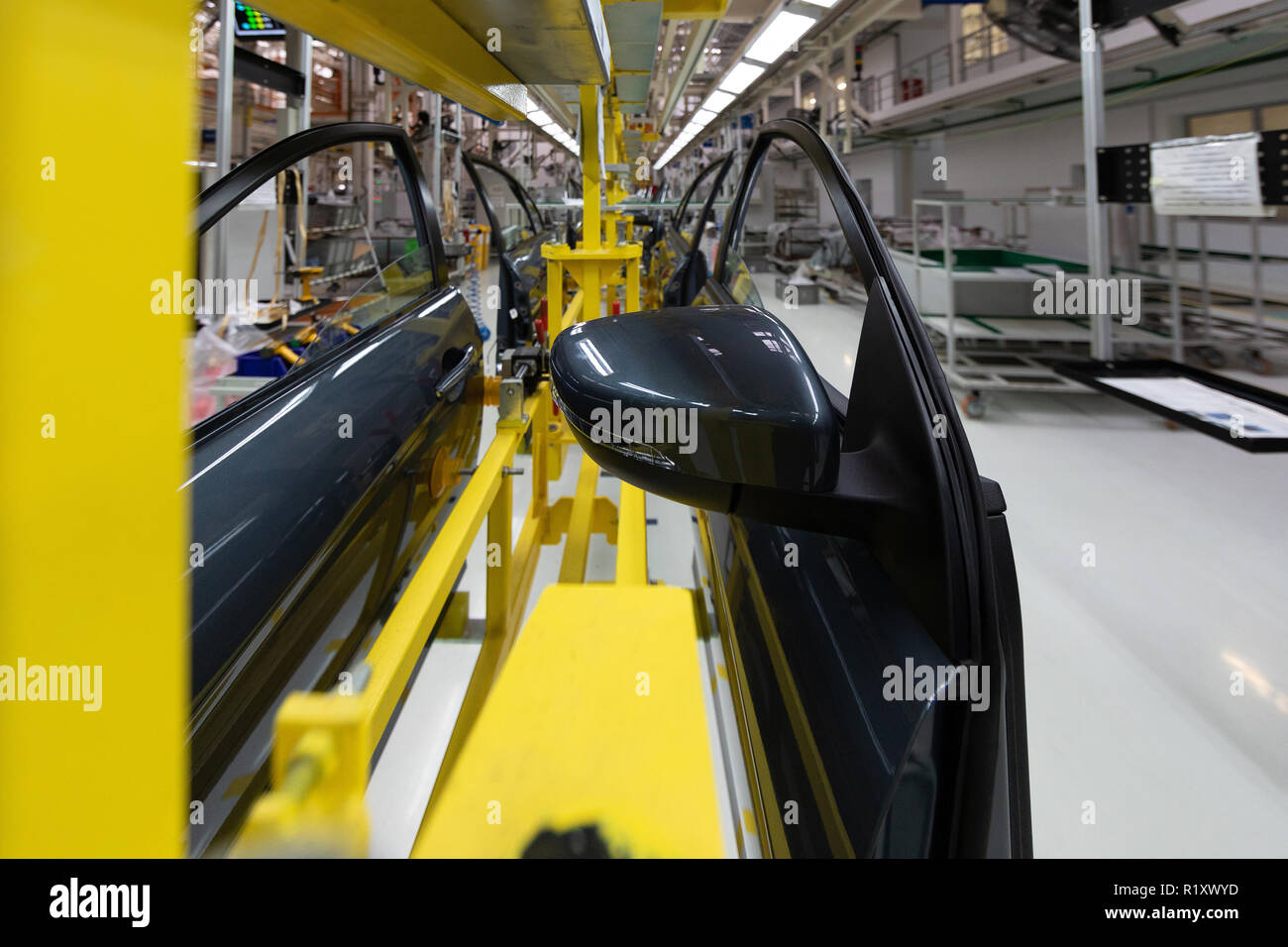 car door on conveyor. Robotic equipment makes Assembly of car. Modern ...