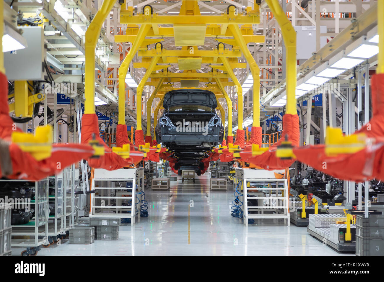 Transfer of car body. Robotic equipment makes Assembly of tcar. Modern ...