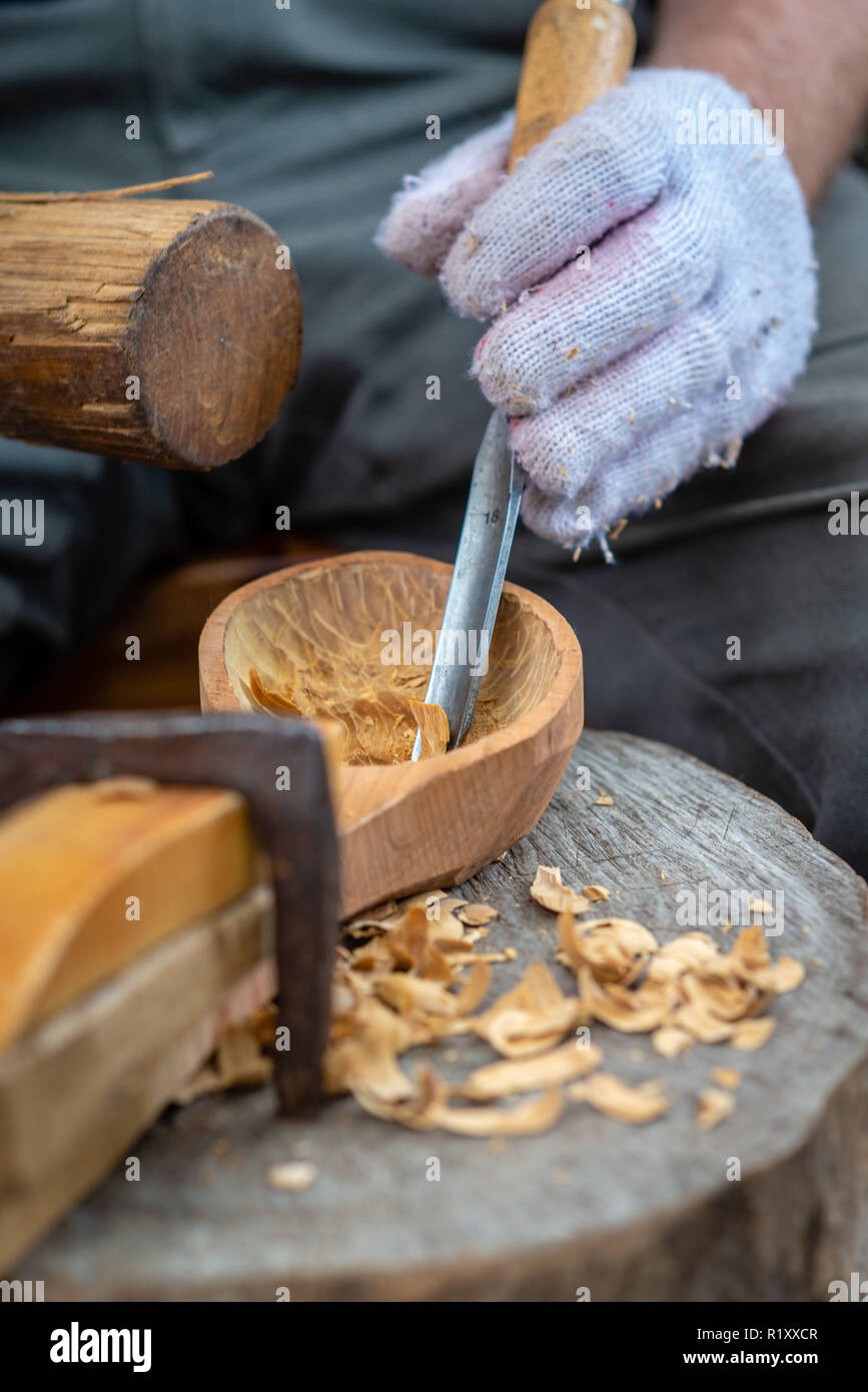 Craftsman demonstrates the process of making wooden spoons handmade ...