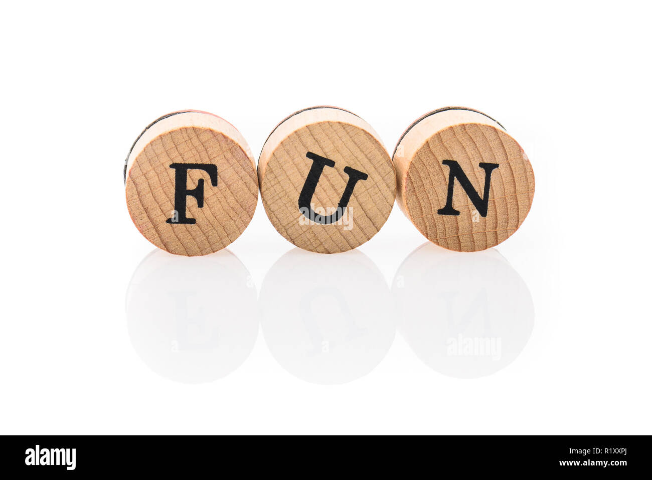 Word Fun from circular wooden tiles with letters children toy. Concept ...