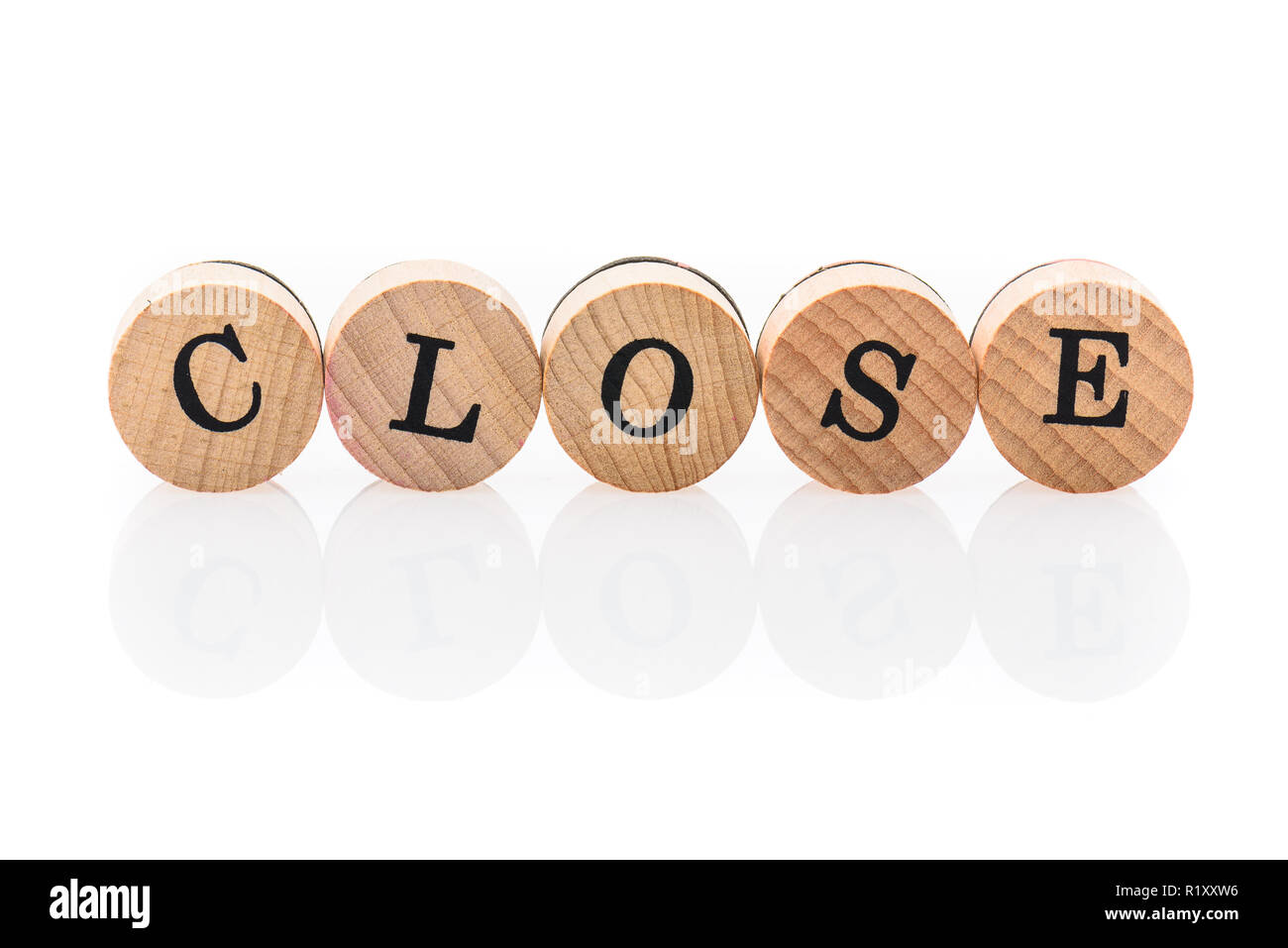 Word Close from circular wooden tiles with letters children toy ...