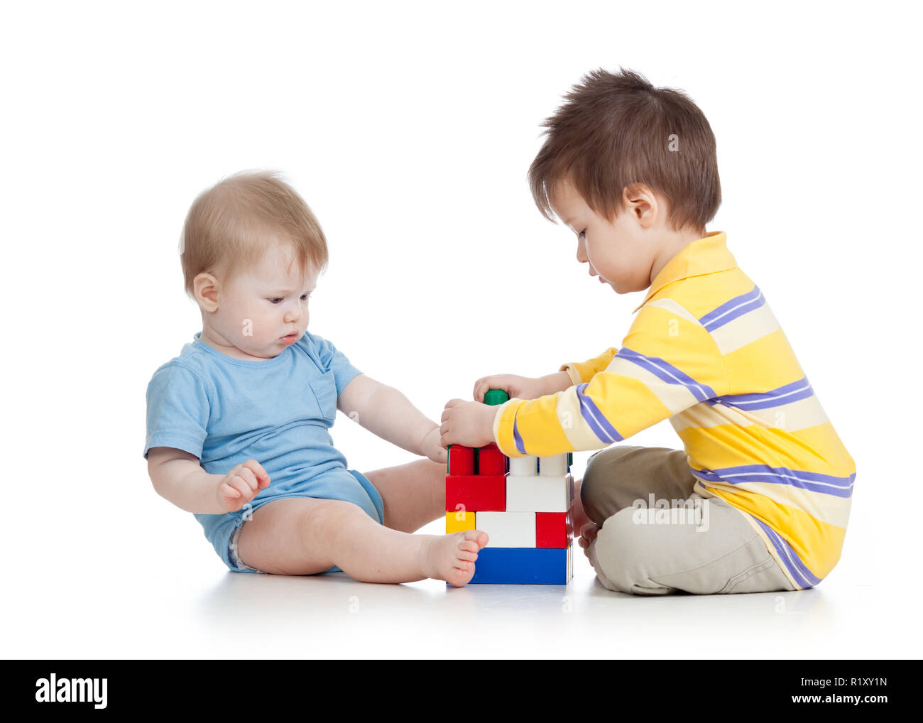 Children boys playing with toys together. Isolated on white background ...