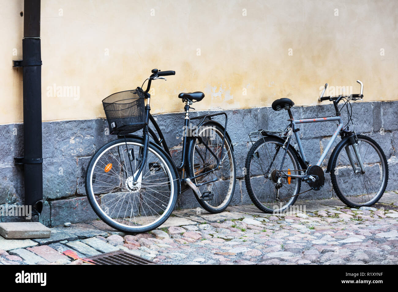 two bicycles on a city street Stock Photo - Alamy