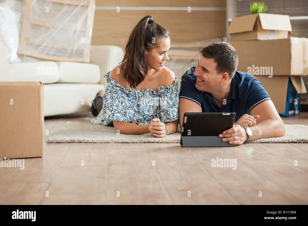 Wife and husband looking after things to buy for their new flat Stock ...