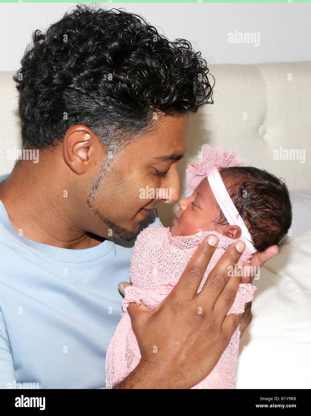 Navid Ali, Naliyah posing for a portrait for Mishael Morgan New Baby ...