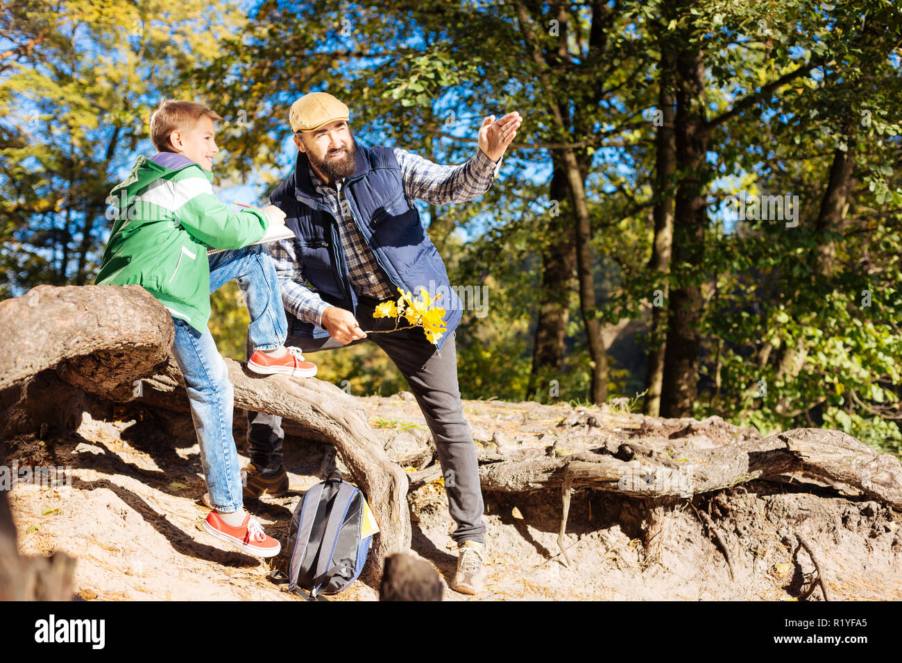 Child pointing at trees hi-res stock photography and images - Alamy