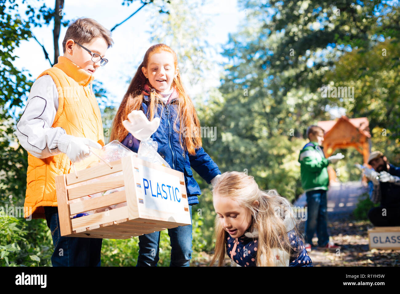 Boy holding a box hi-res stock photography and images - Alamy
