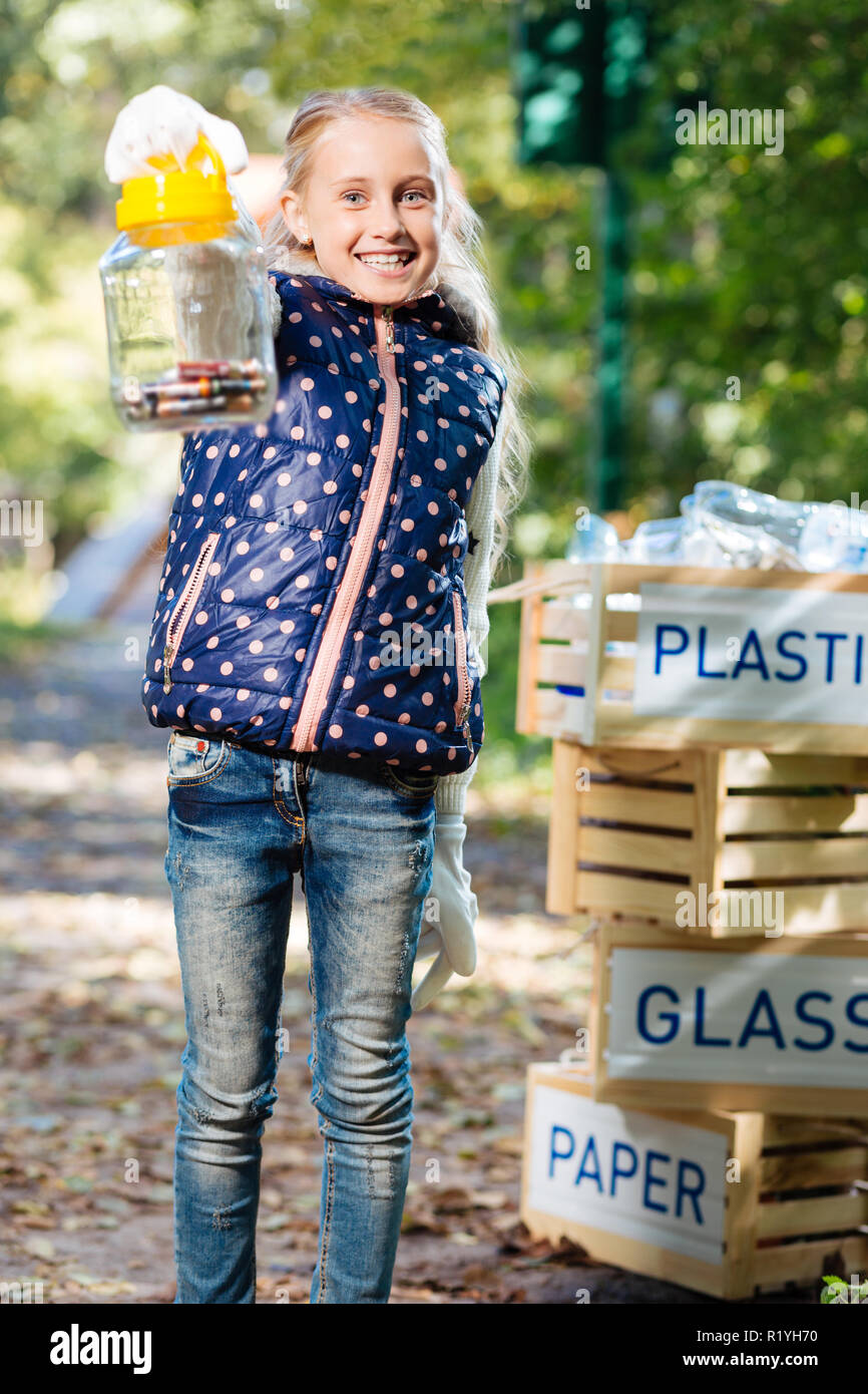 Joyful nice girl helping to save the environment Stock Photo - Alamy
