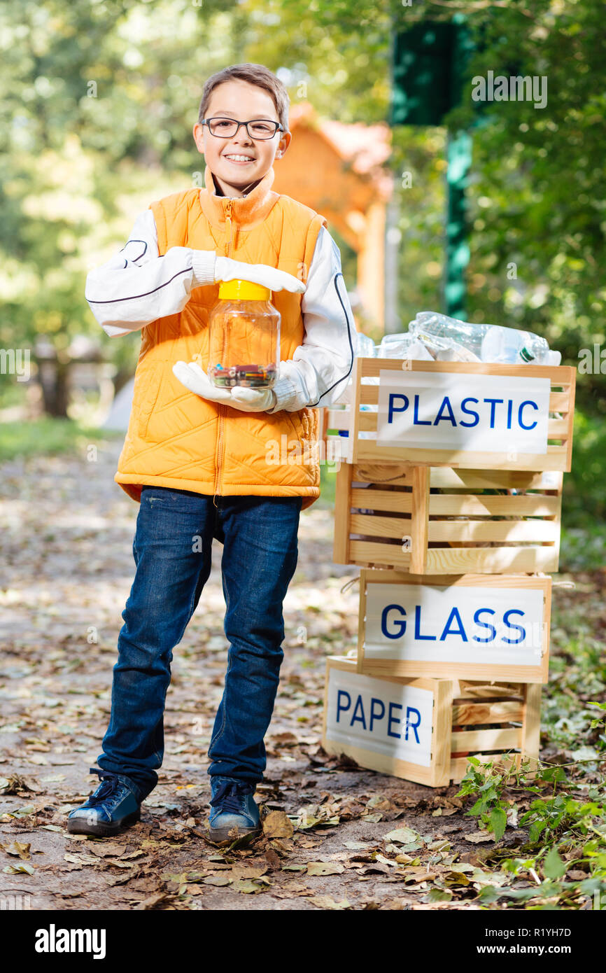 Positive nice young boy collecting dangerous waste Stock Photo - Alamy