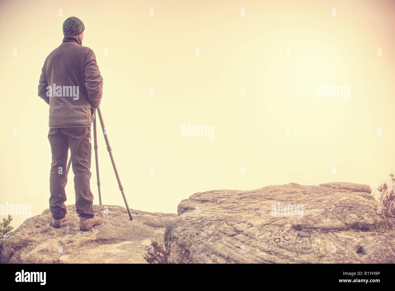 Photographer taking authentic outdoor photos in autumn landscape by big ...